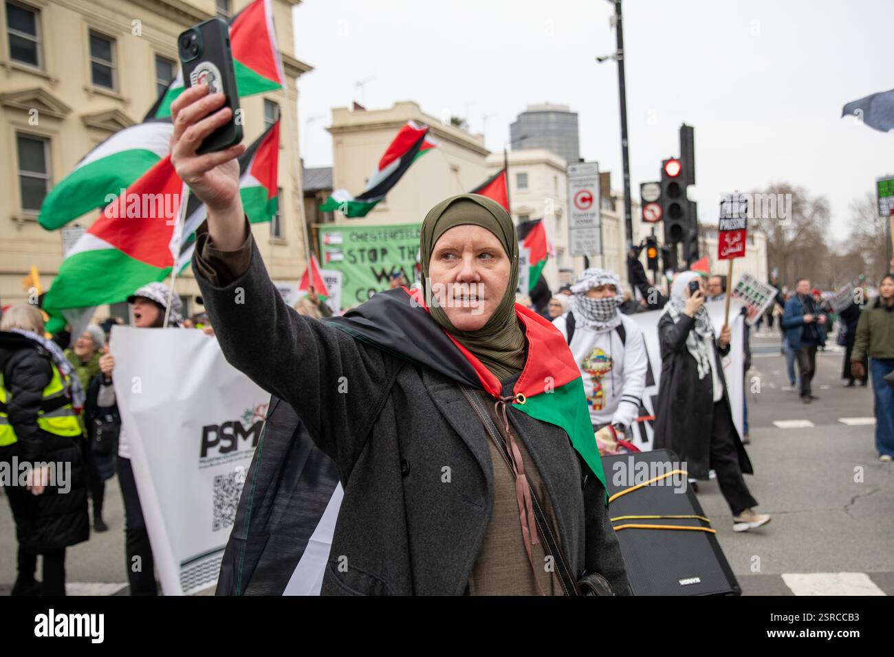 London, UK, 15th February 2025. A Pro Palestinian demonstrator holds up ...