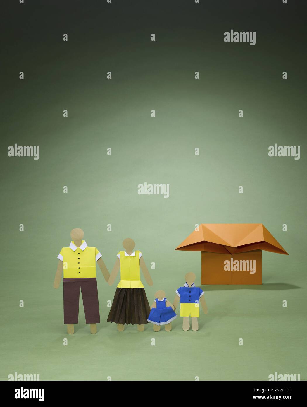 Origami family icon in front of house India Asia Stock Photo - Alamy