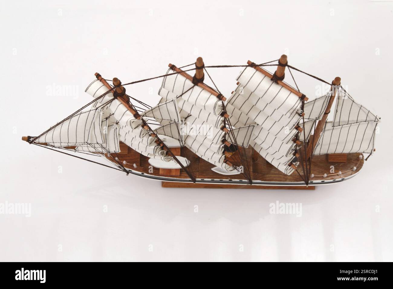 Miniature toy sailing boat on white background Stock Photo - Alamy