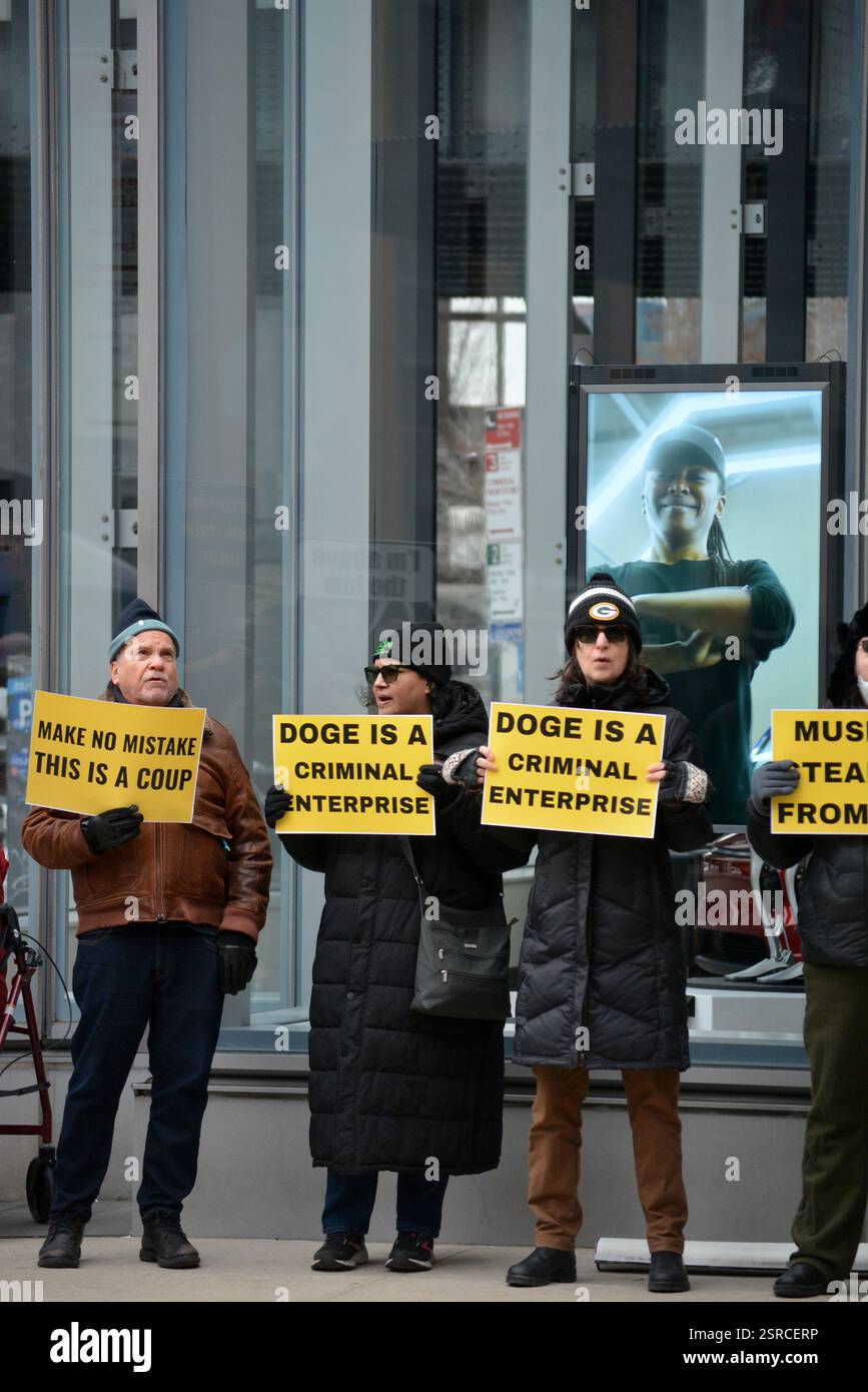 Demonstrators taking part in a "Tesla Takeover" event against Elon Musk ...