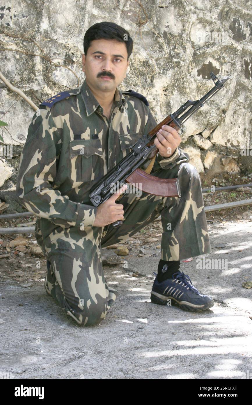 Black Cat commando with an AK 47 light machine gun MR#725 Stock Photo ...