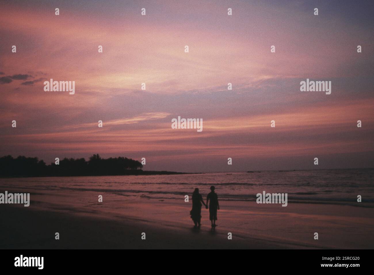 Couple at sunset, Chiula Beach in Malvan, Konkan, Maharashtra, India ...