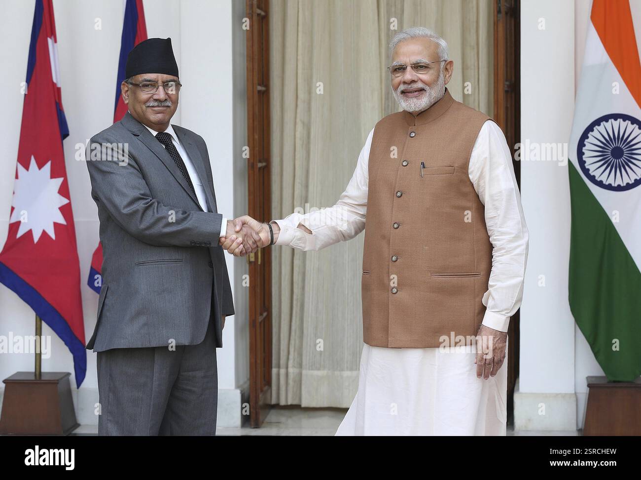 Prime Minister Narendra Modi shakes hand with Nepal Prime Minister ...