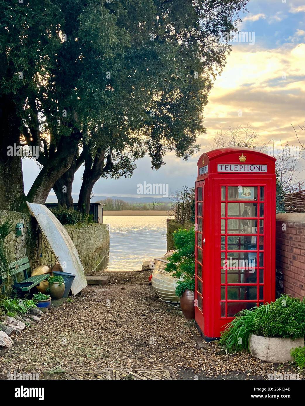 An Iconic British Red Telephone Box in a Peaceful Riverside Setting ...
