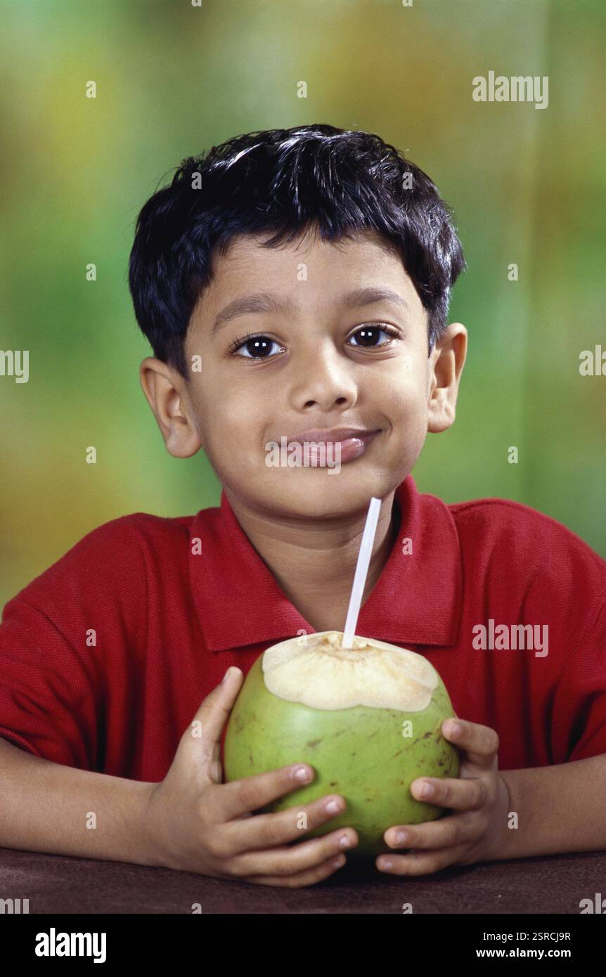 Child drinking coconut water, India MR#152 Stock Photo - Alamy