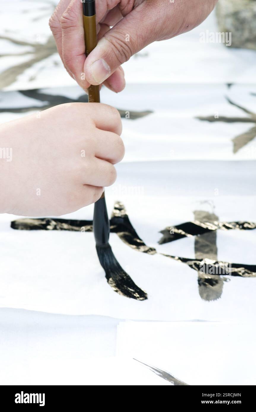 Teacher Helping Student drawing hieroglyph, poland Stock Photo - Alamy