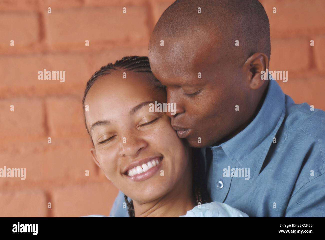 African man kissing on woman cheek MR#733 Stock Photo - Alamy