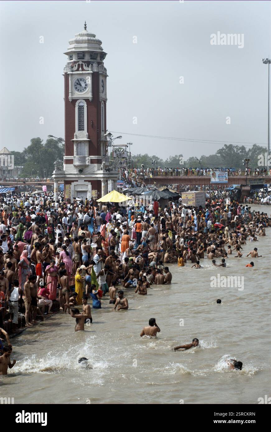 Devotees on riverbank ghats of river ganga ganges taking holy dip at ...