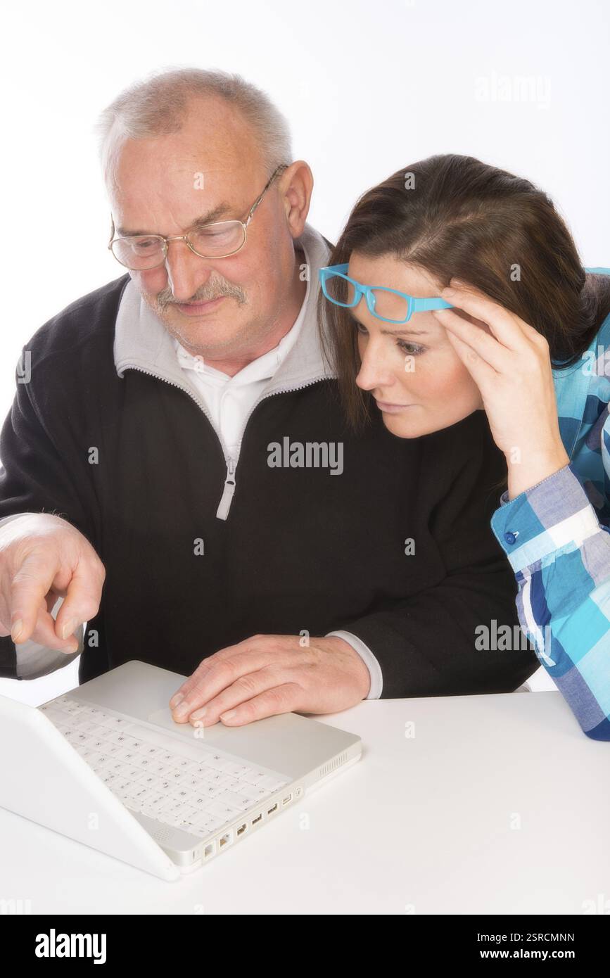 Helping with new computer Stock Photo - Alamy