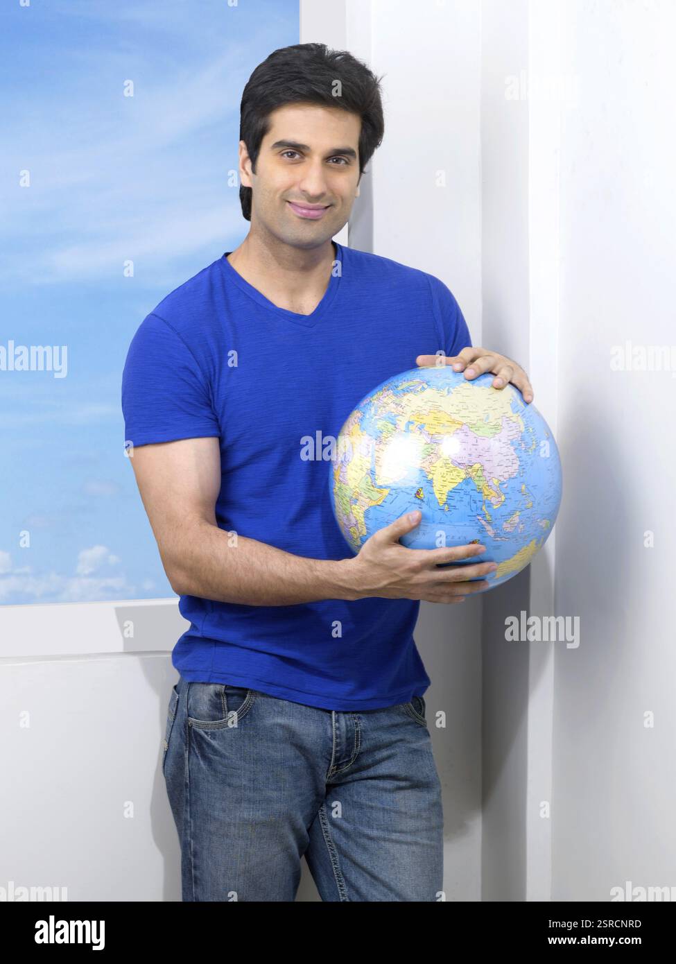 Man holding globe world, MR#779L Stock Photo - Alamy