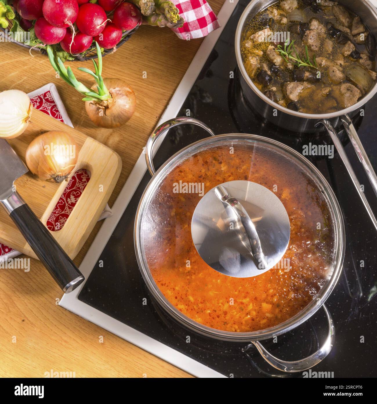 People cooking on cooker hi-res stock photography and images - Alamy