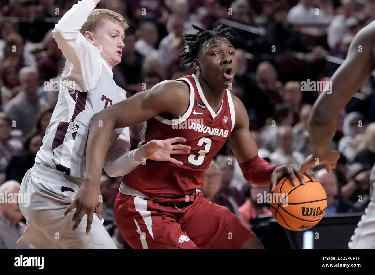 Arkansas forward Adou Thiero, right, drives the lane against Texas A&M ...