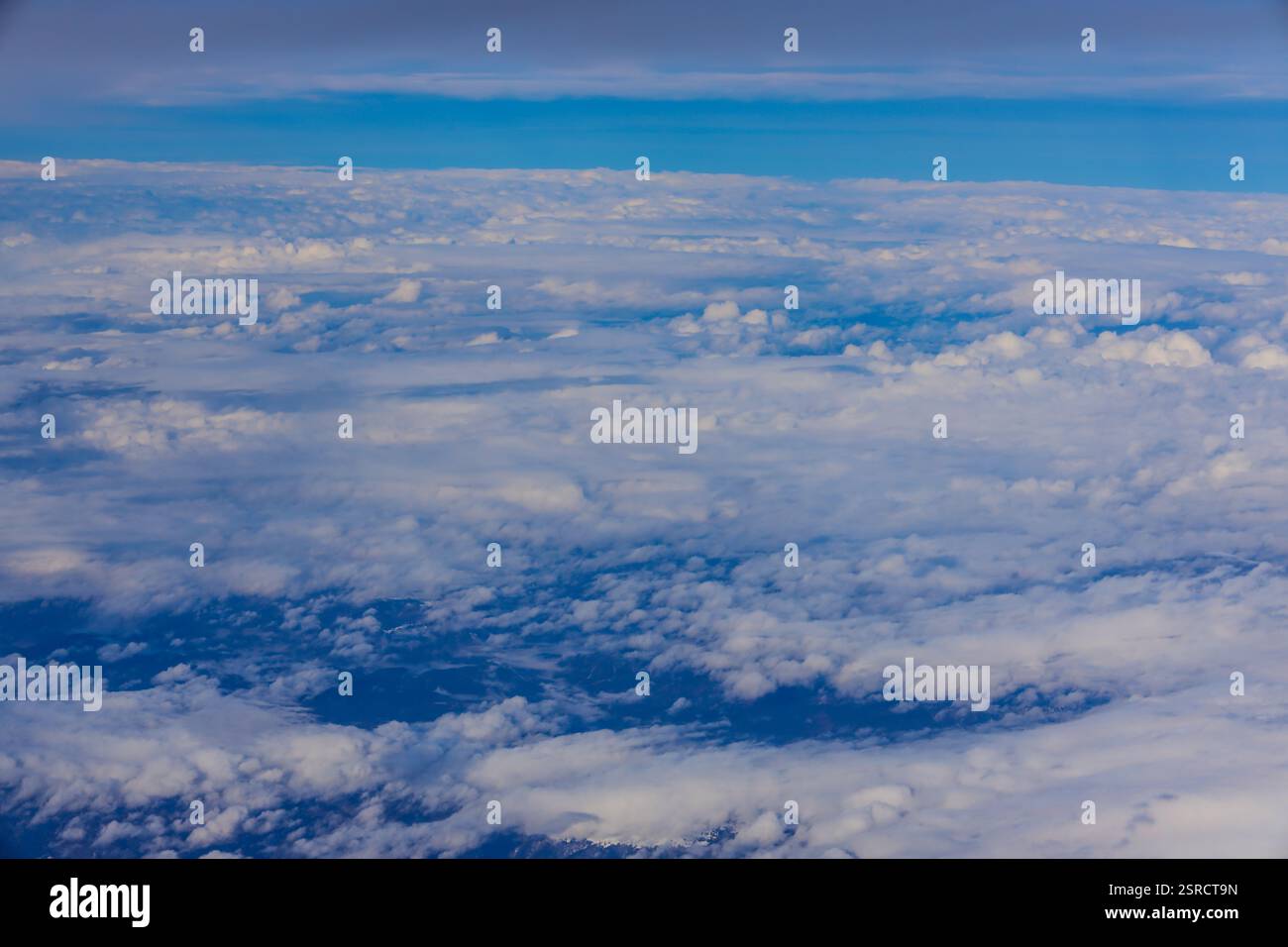 Clouds land below from airplane hi-res stock photography and images - Alamy