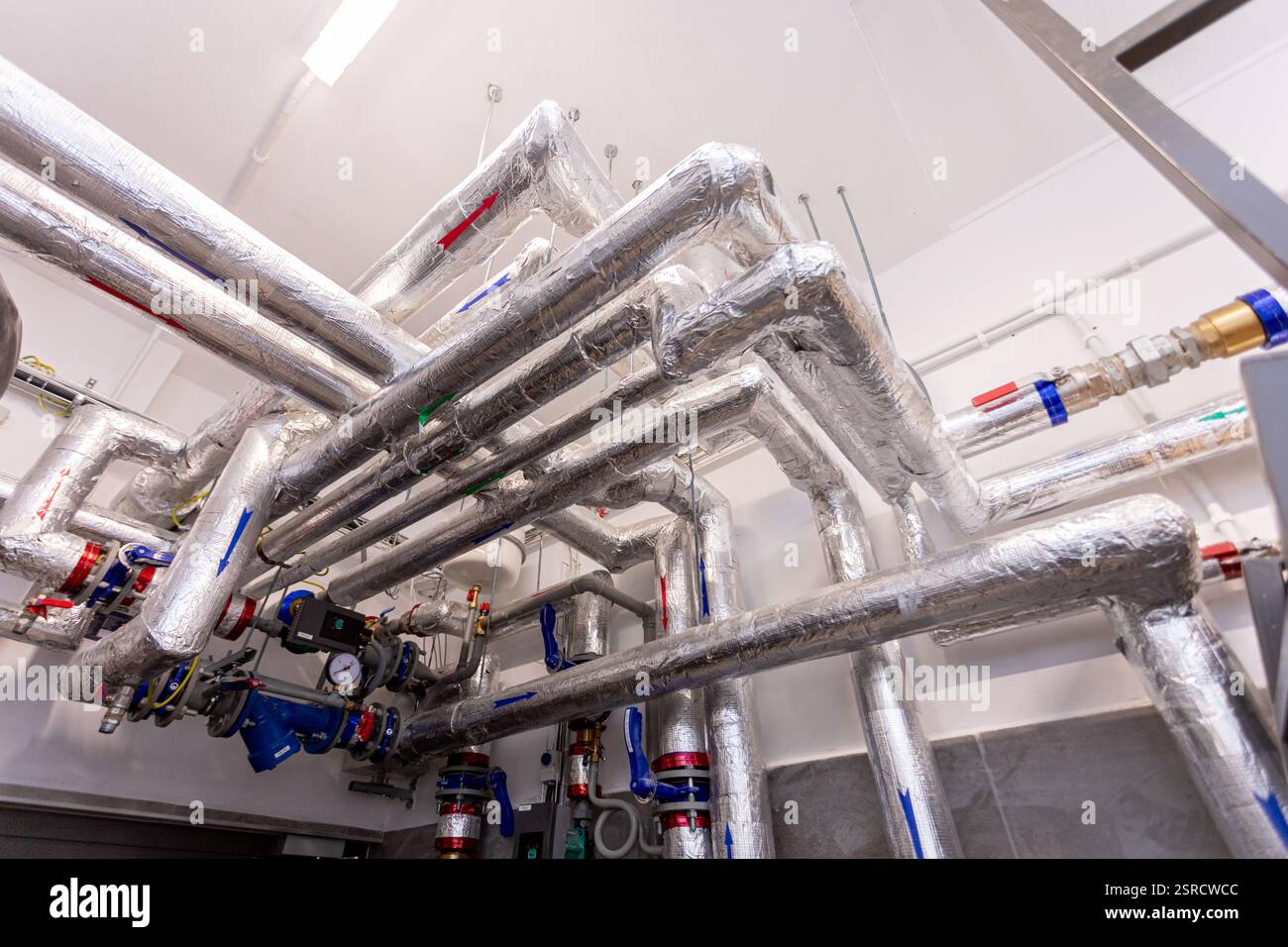 A complex pipe system in a modern facility using various technologies ...