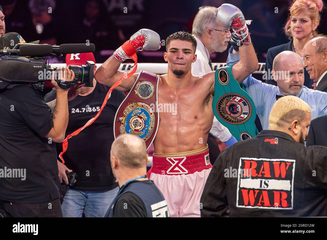 February 14, 2025, New York, New York, USA: XANDER ZAYAS (pink and ...