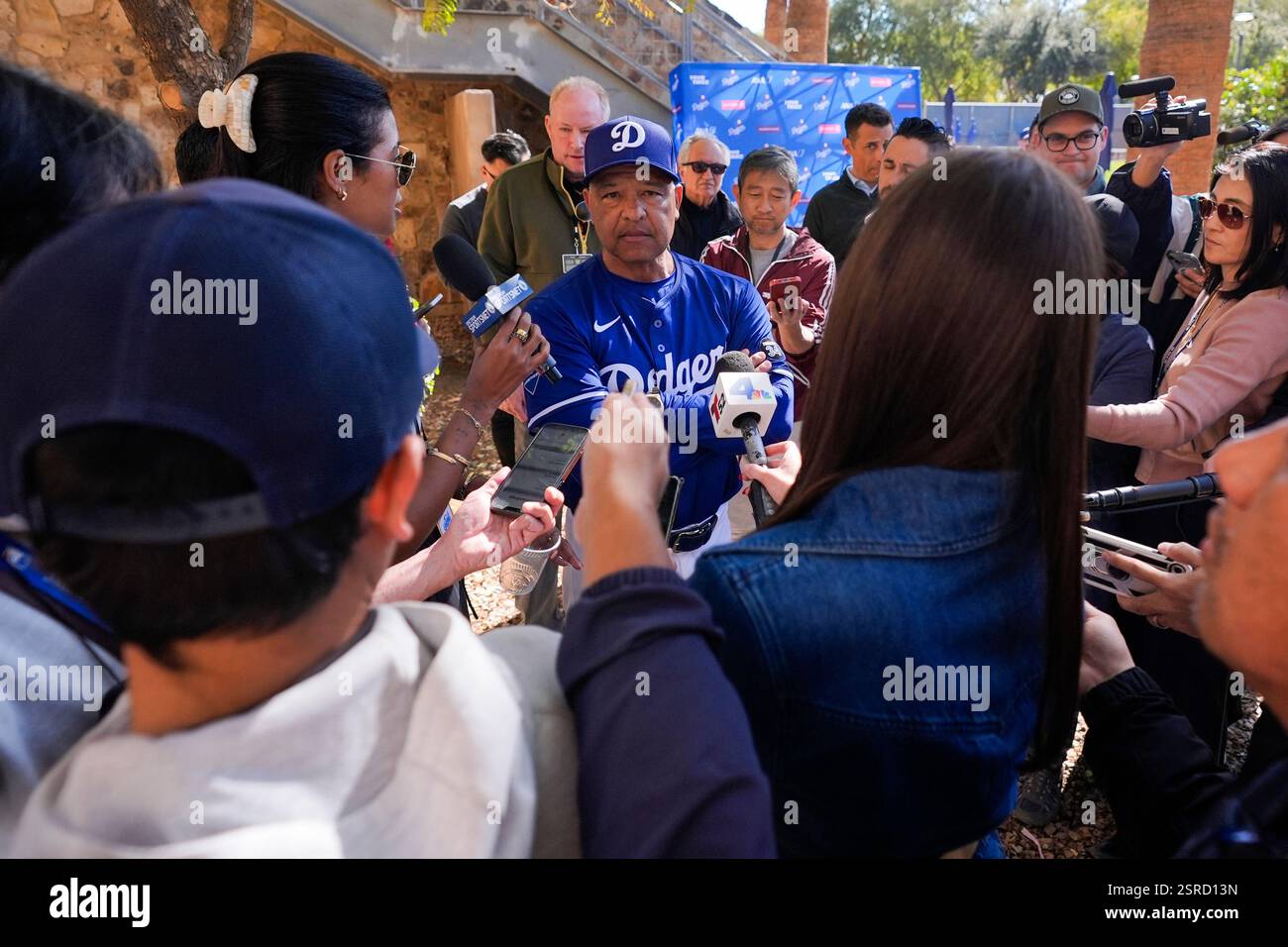 Los Angeles Dodgers manager Dave Roberts, center, speaks to reporters ...