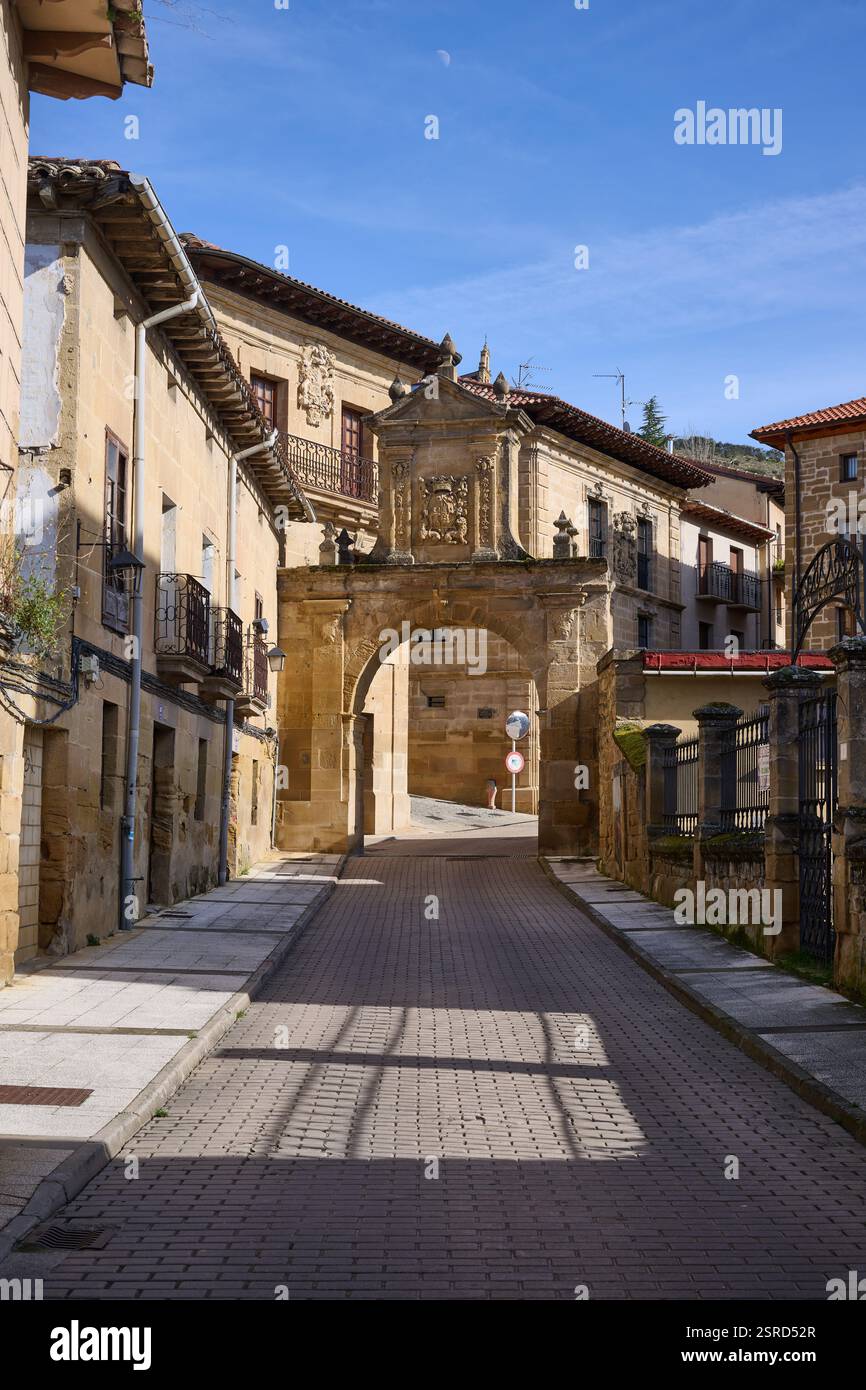 Manor house and heraldic shield over the entrance arch to the town of ...
