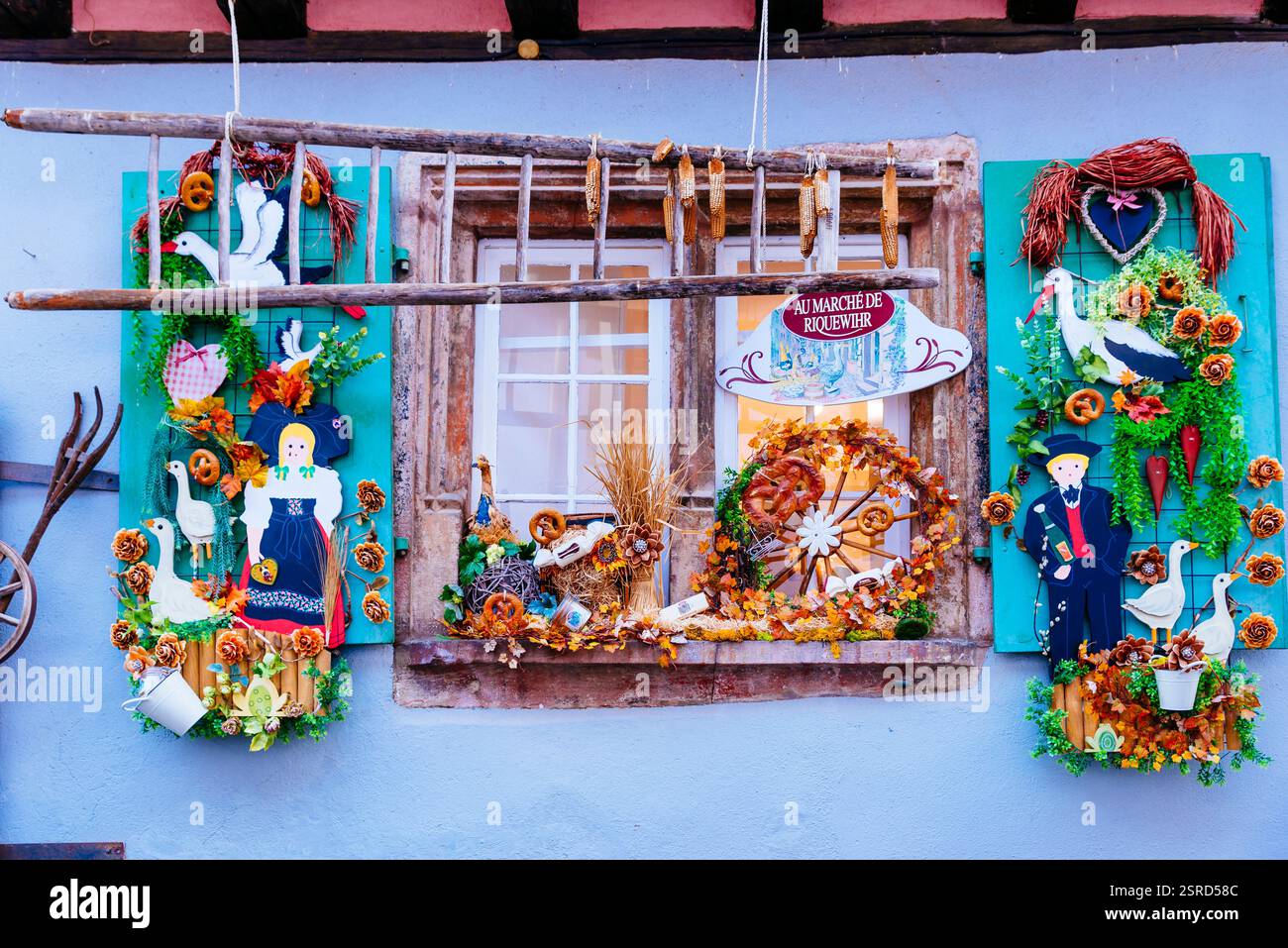 Shutters with storks. The stork is the symbol of Alsace and a bird that ...