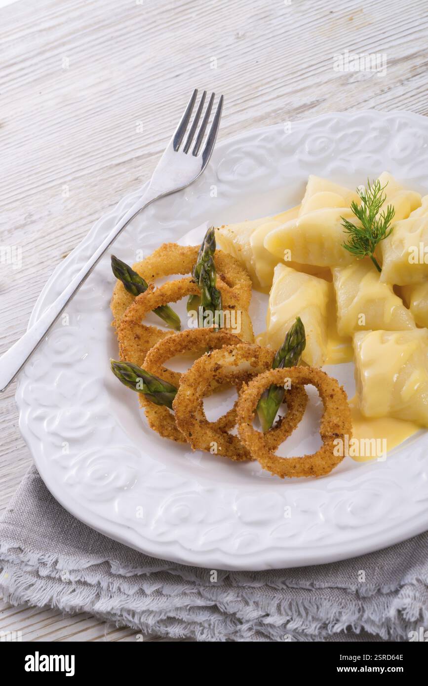 Onion ring white potato dumpling Stock Photo - Alamy
