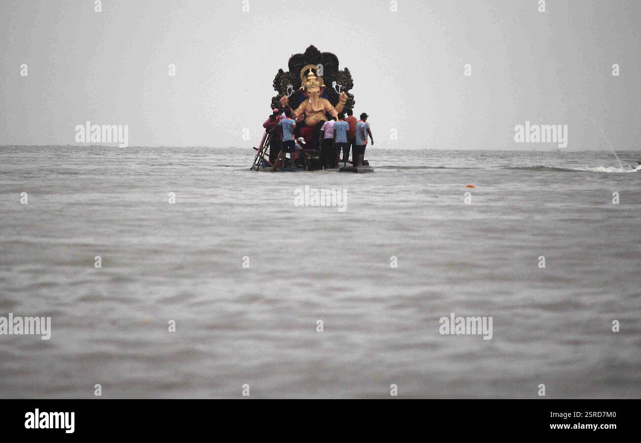 A gigantic idol of Hindu elephant-headed god Ganesh, being led to the ...