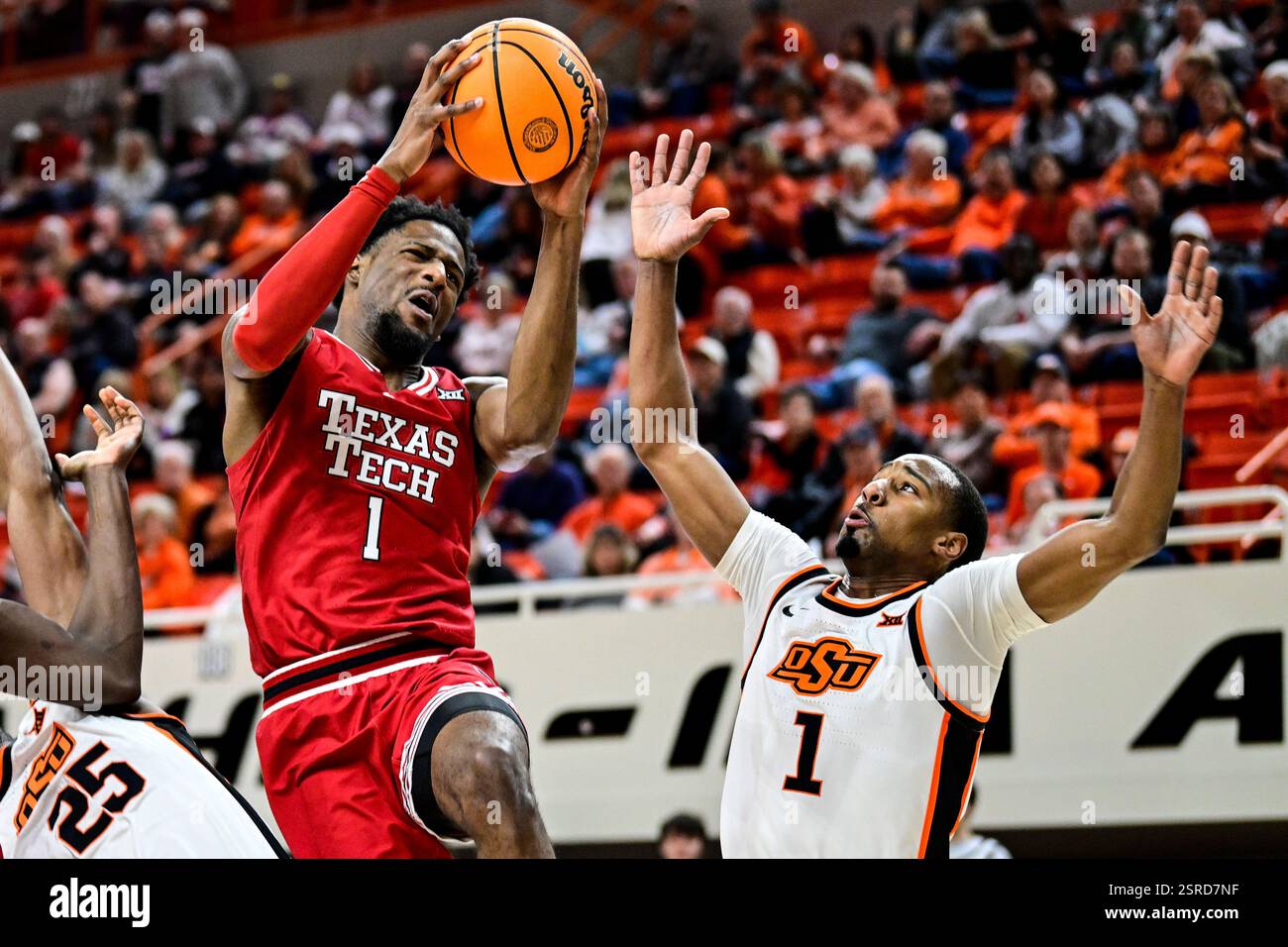 Texas Tech guard Kevin Overton (1) shoots over Oklahoma State guard ...