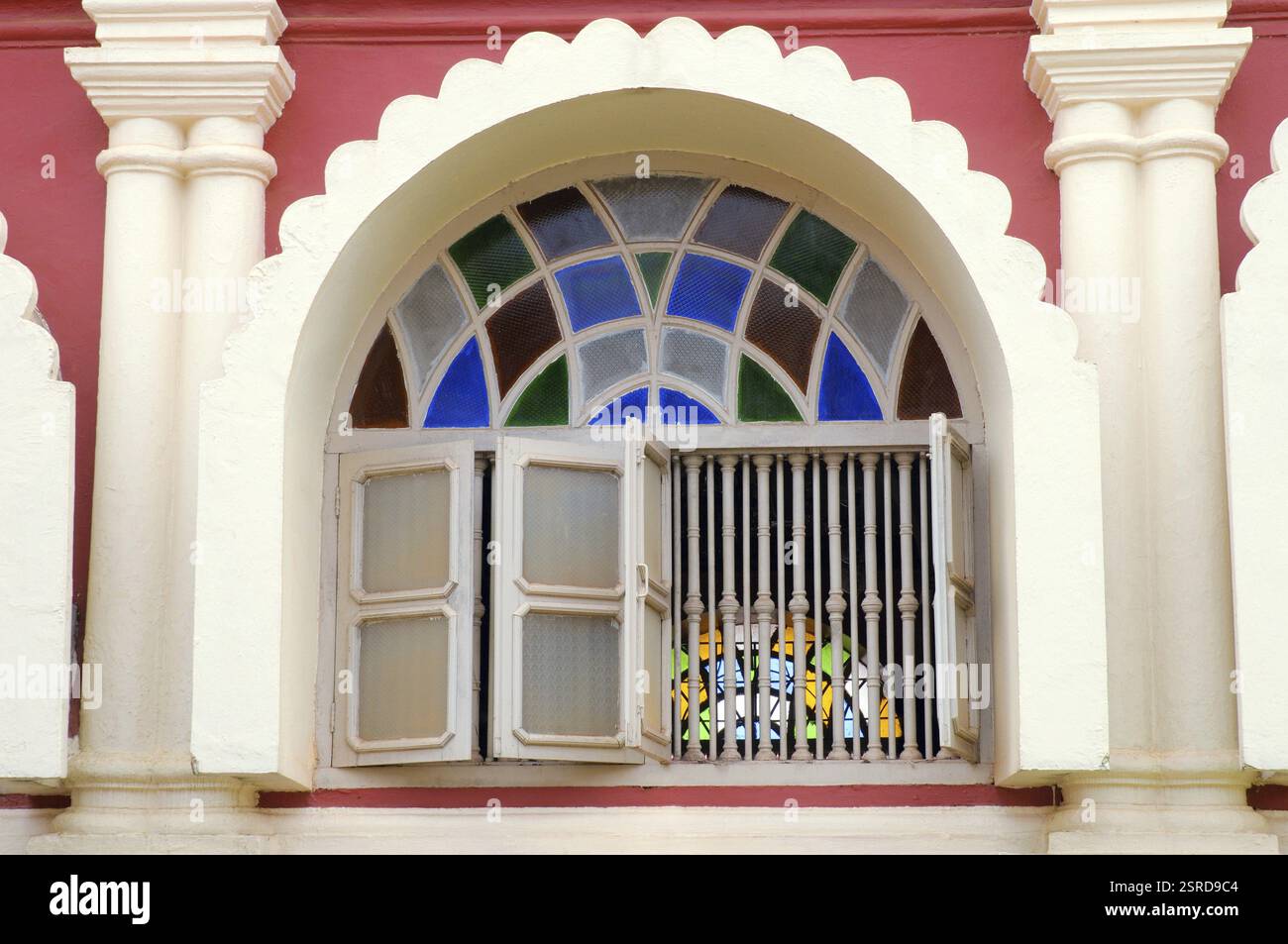 Carved window with stained glass Goa Maharashtra India Asia September ...