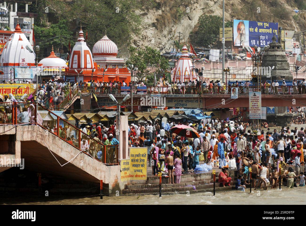 Devotees on riverbank ghats of river ganga ganges taking holy dip at ...