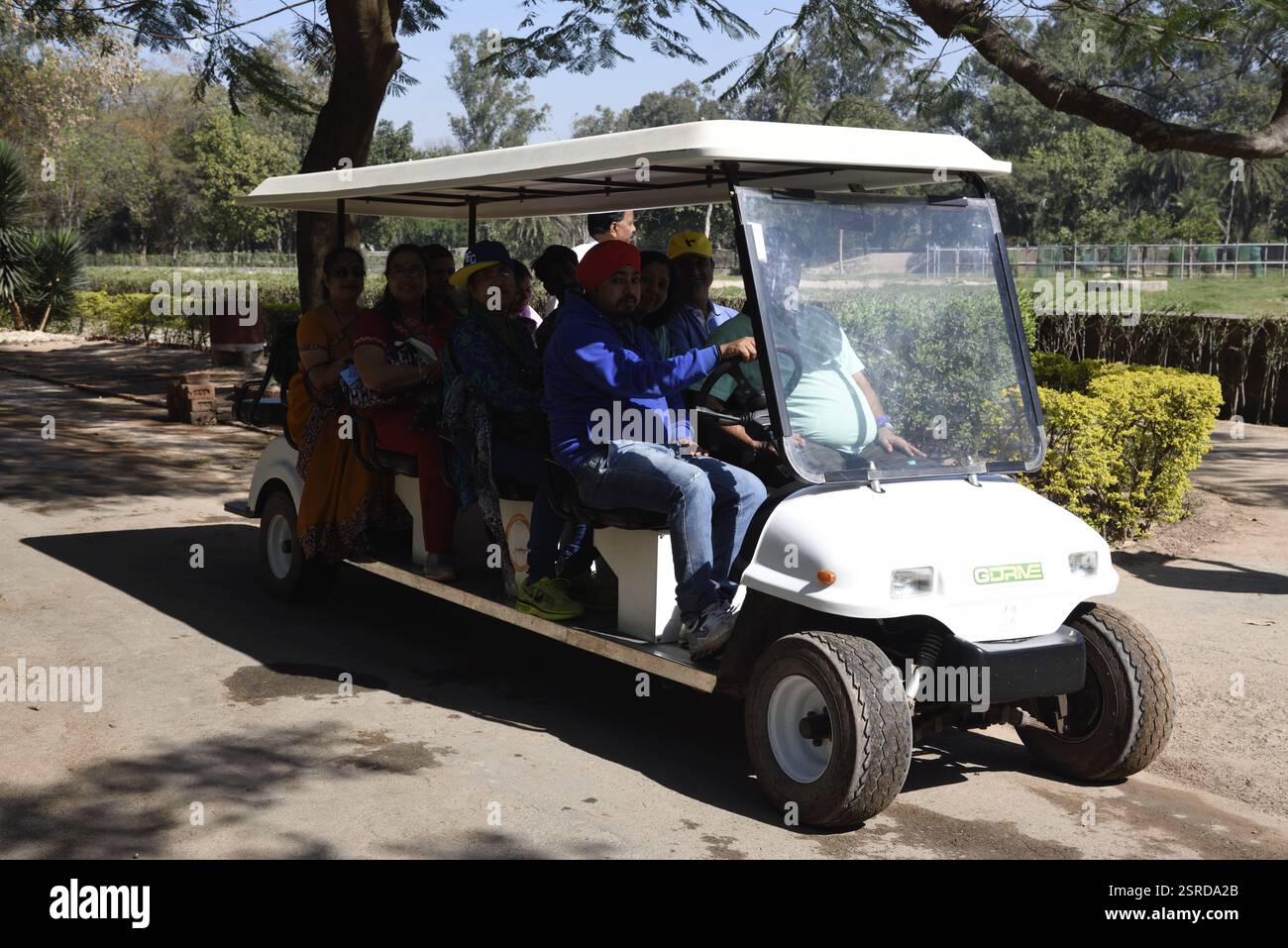 Tourists in Eco friendly Electric vehicle, Mahendra Choudhary zoo, Chandigarh, haryana, India ...