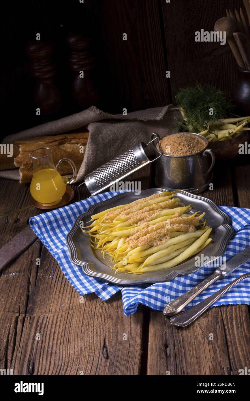 Yellow string bean with bread crumbs Stock Photo - Alamy