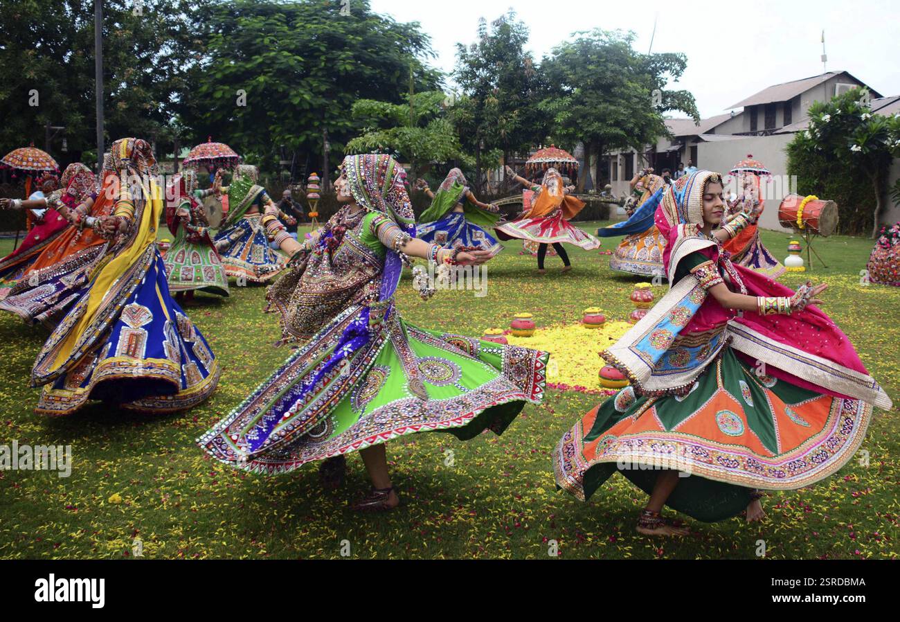 Girls in traditional attire, practice the Garba dance steps in ...