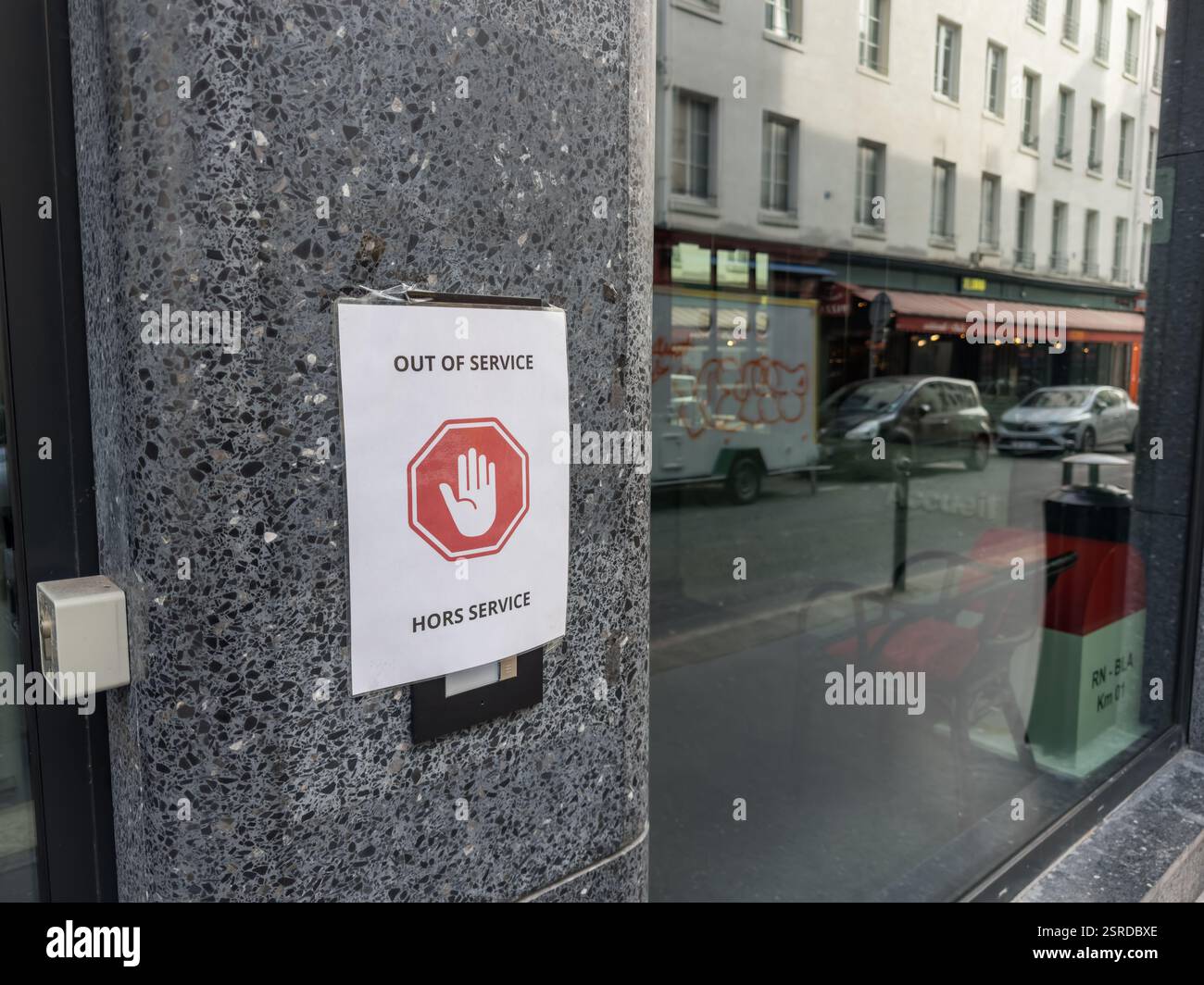 Out of service sign on a city street adds curiosity to bustling ...