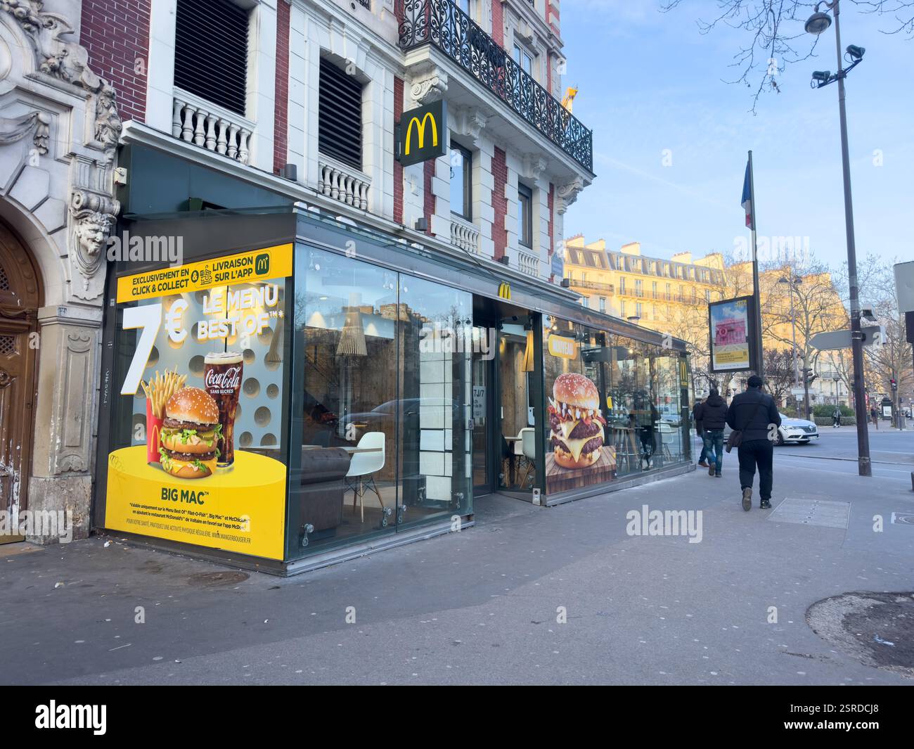 Visit a lively fast food spot with bright signs in the city Stock Photo ...