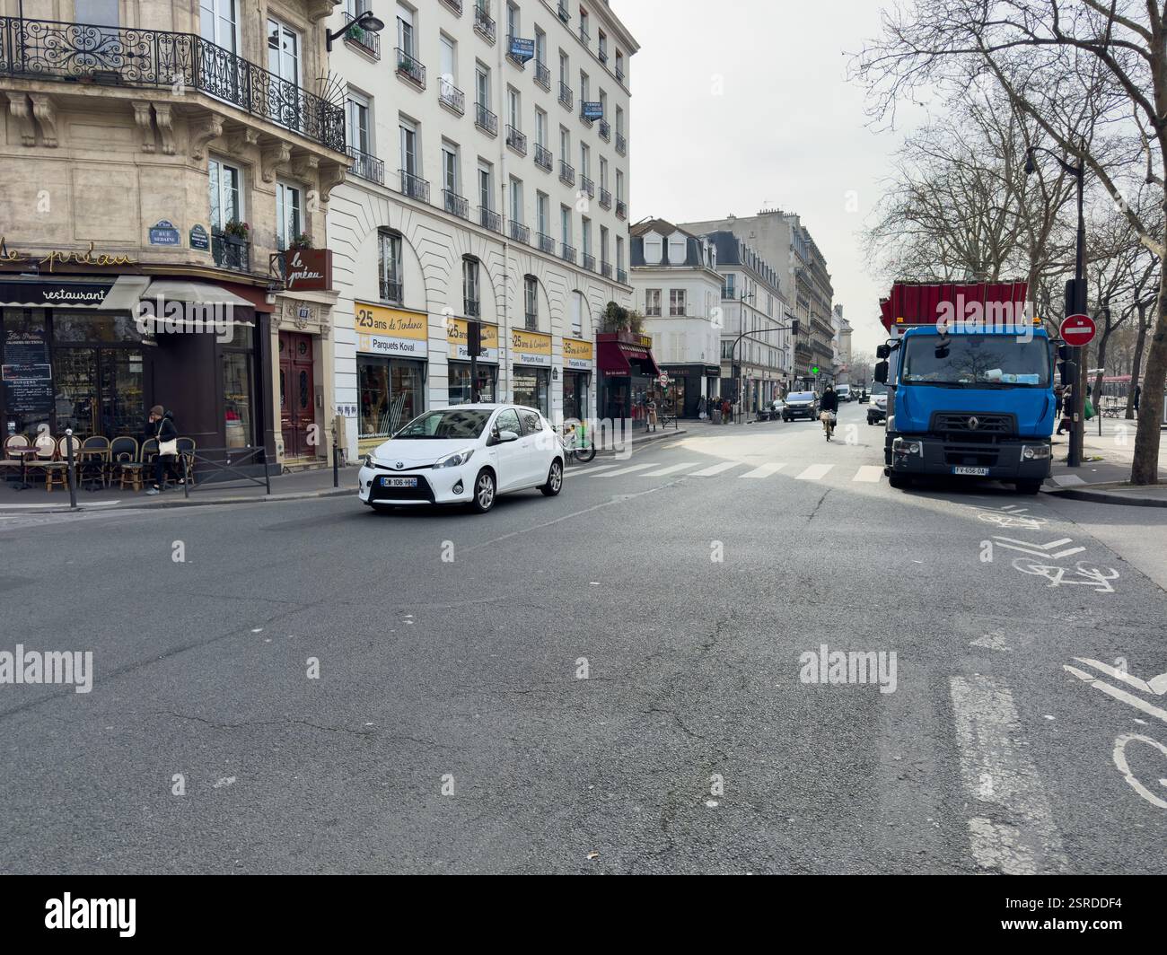 Charming city intersection with a cafe and delivery truck in the heart ...