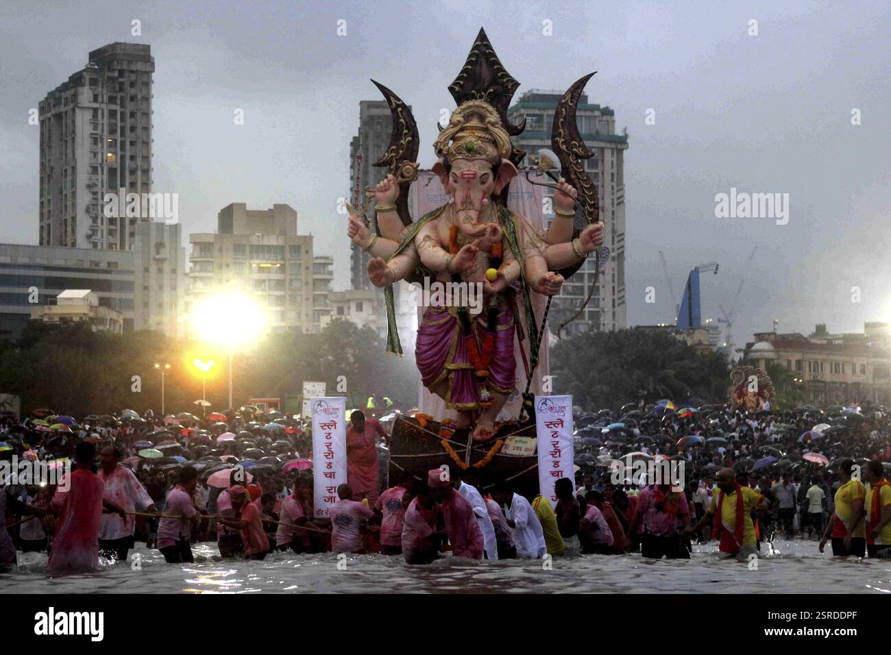 A gigantic idol of Hindu elephant-headed god Ganesh, being led to the ...