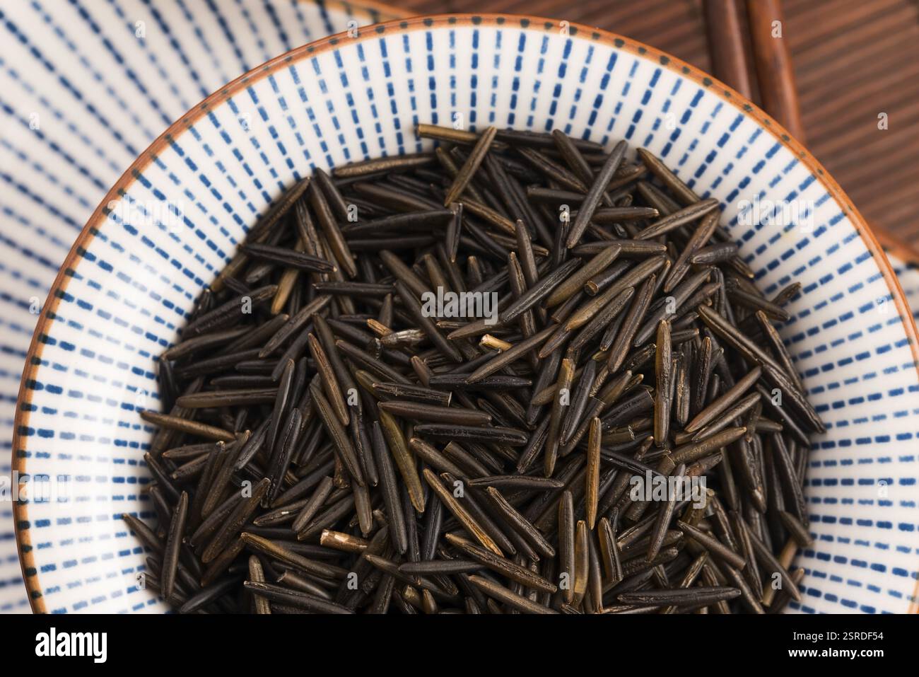 Wild rice in a white ceramic bowl Stock Photo - Alamy