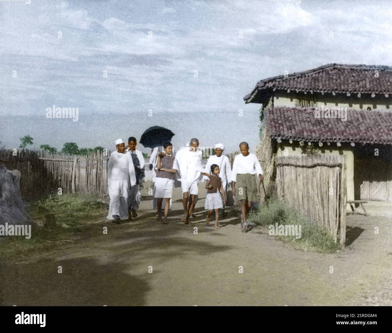 Mahatma Gandhi, Abha Gandhi (with umbrella) and others at Satyagraha ...