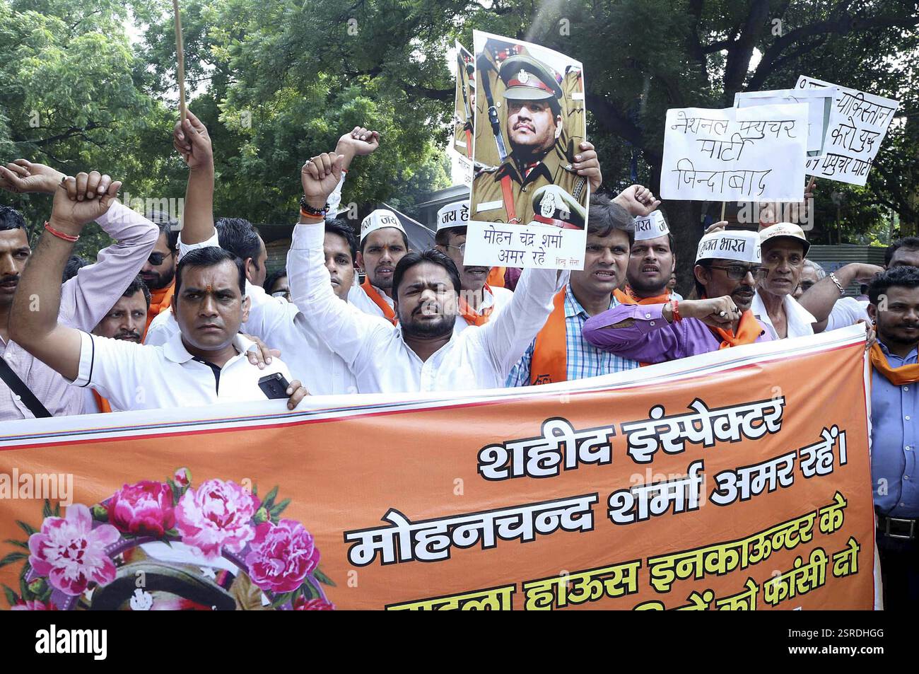 Hindu activists shout slogan during a protest against attack at an ...