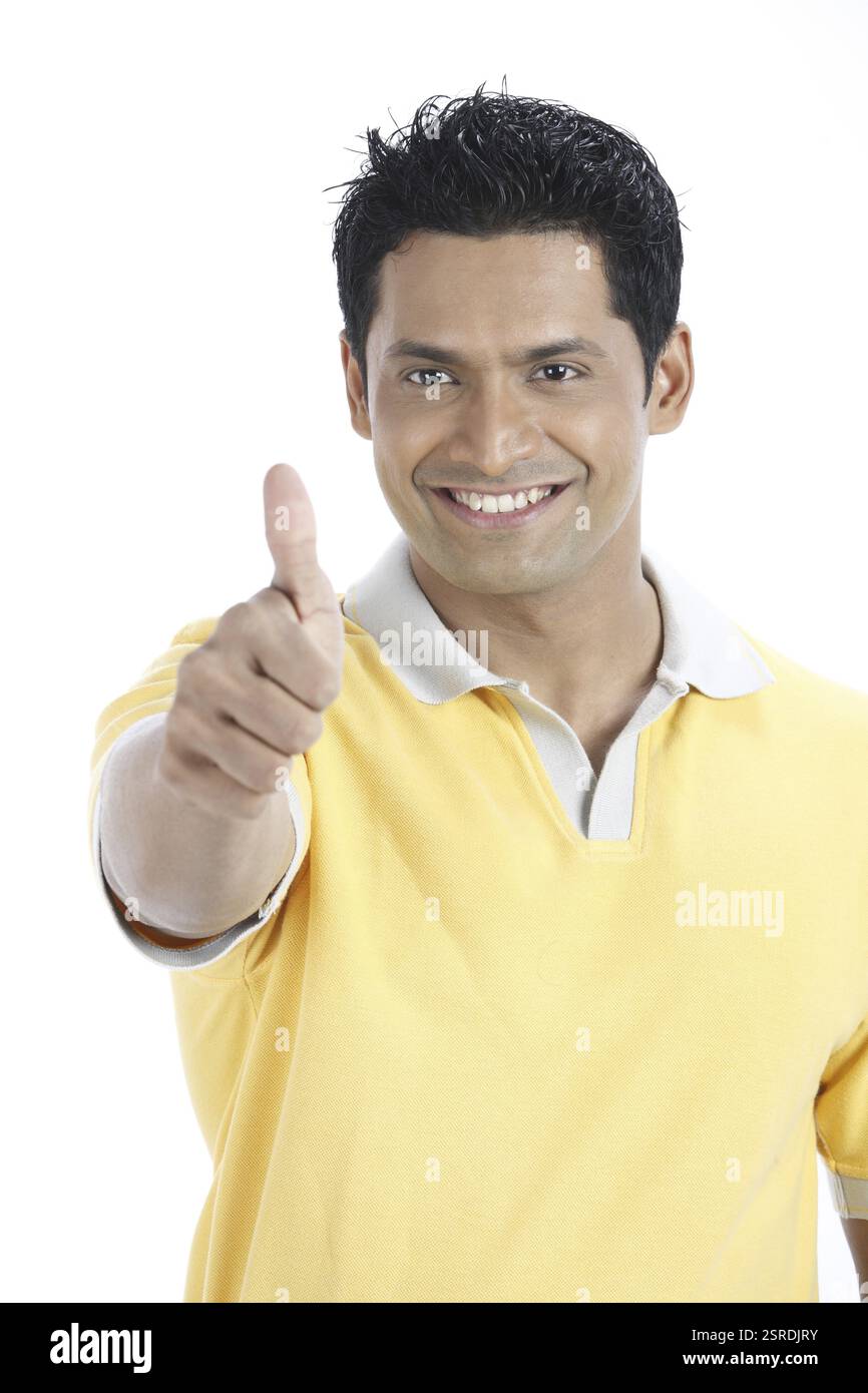 Confident young man doing winning action enjoying success by making ...