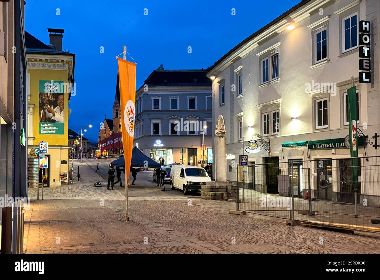 Police officers work at the scene where a 23-year-old man stabbed ...