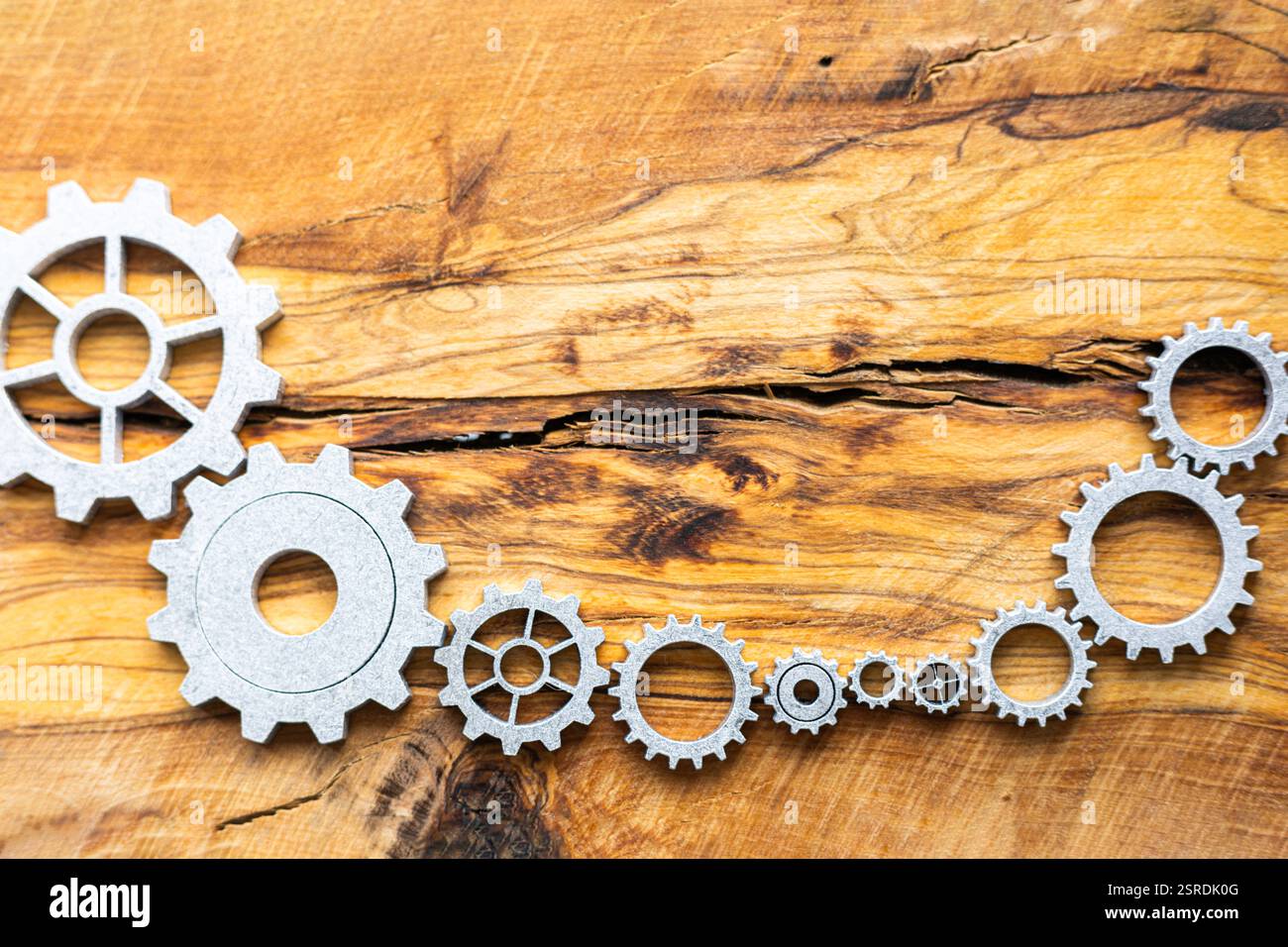 Wooden gears different sizes hi-res stock photography and images - Alamy