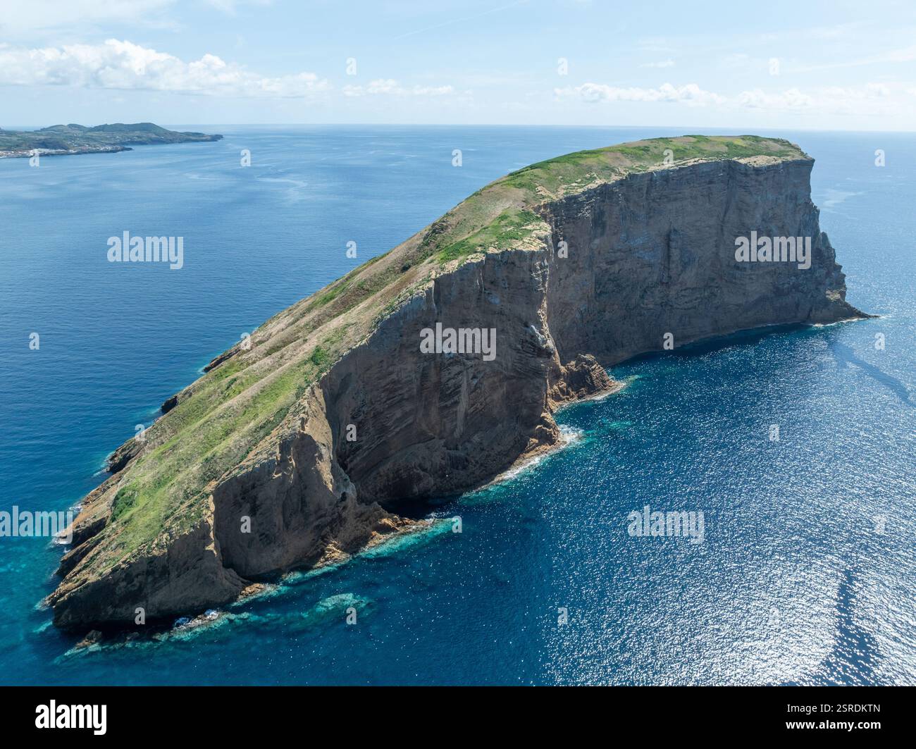 Small islets in coastline of Terceira Island in Azores called Ilheus ...