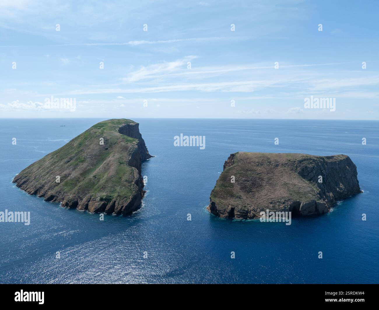 Small islets in coastline of Terceira Island in Azores called Ilheus ...