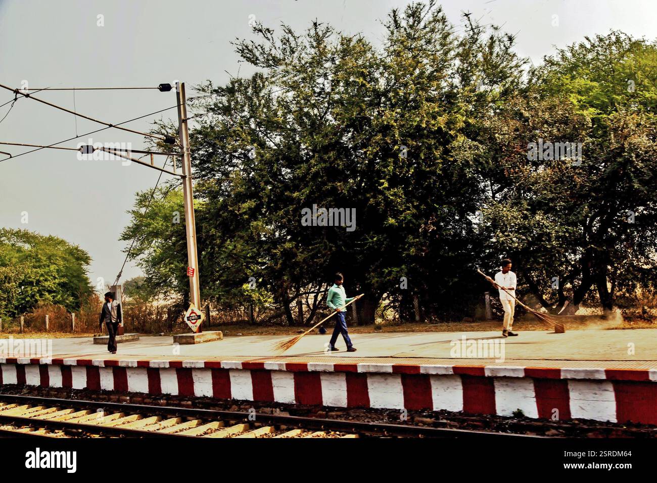 Sweepers sweeping platform, Dagori Railway Station, Bilaspur ...