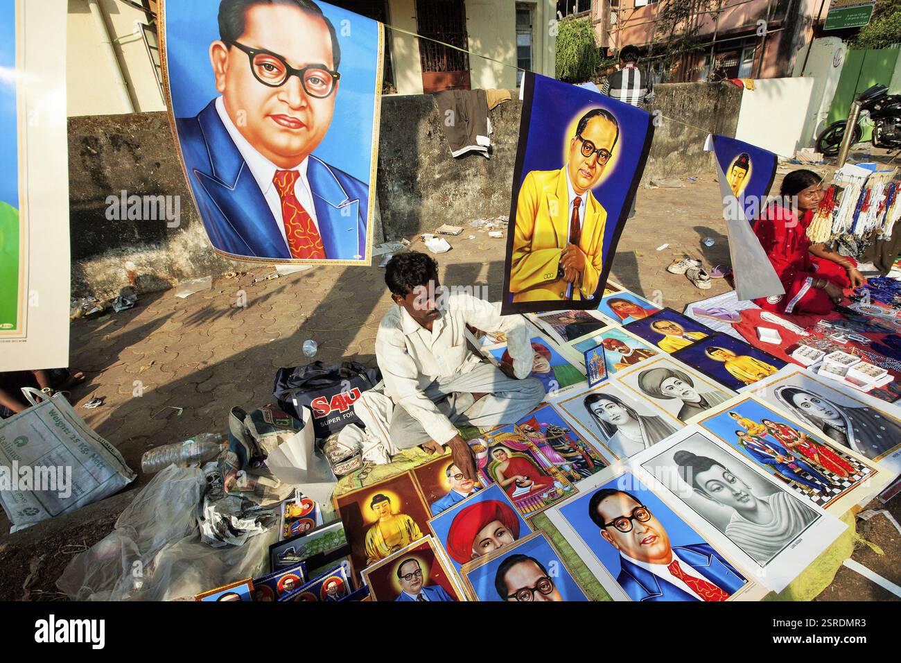 Hawker selling posters on pavement, Dadar, Mumbai, Maharashtra, India ...