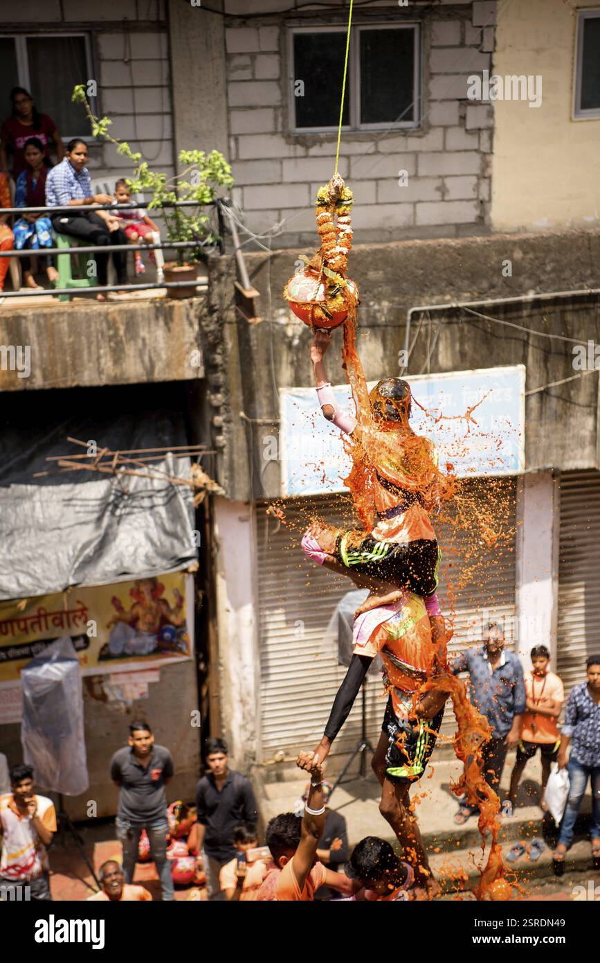 Men human pyramid breaking Dahi Handi, Janmashtami festival, Mumbai ...