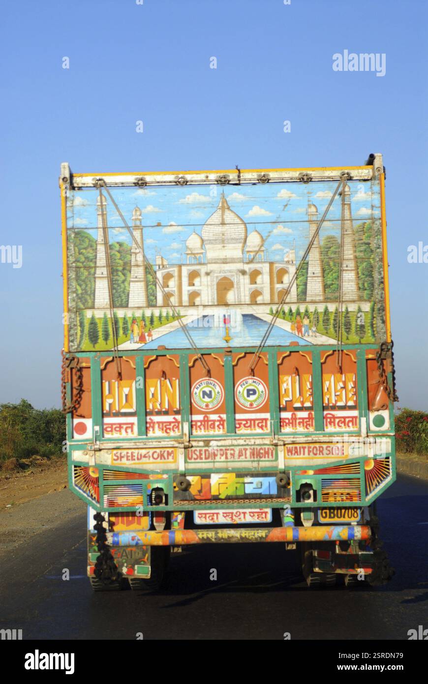 Truck on highway painted message horn please at backside Stock Photo ...