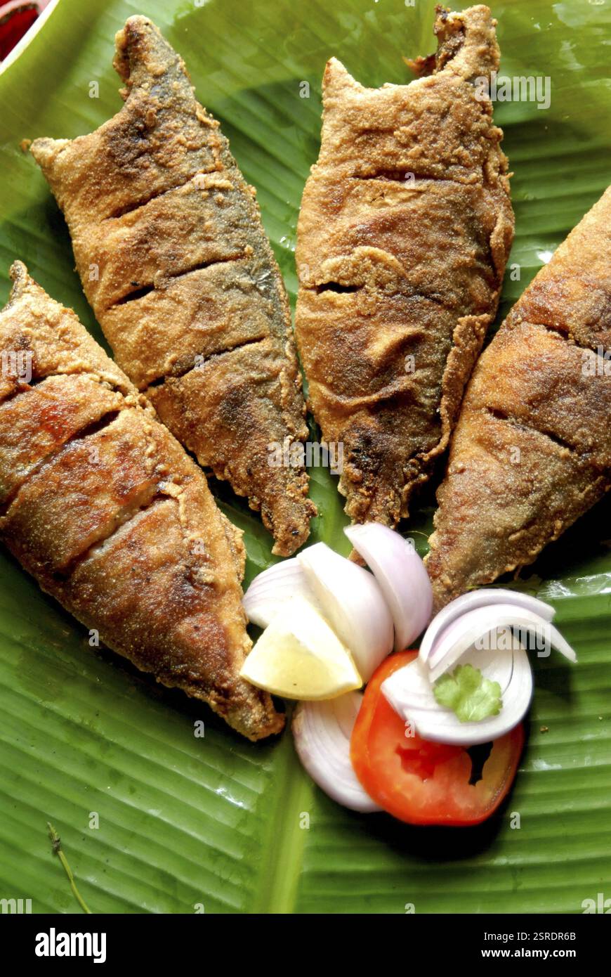 Seafood, fried fish mackerel bangda on banana leaf, Konkan, Maharashtra ...