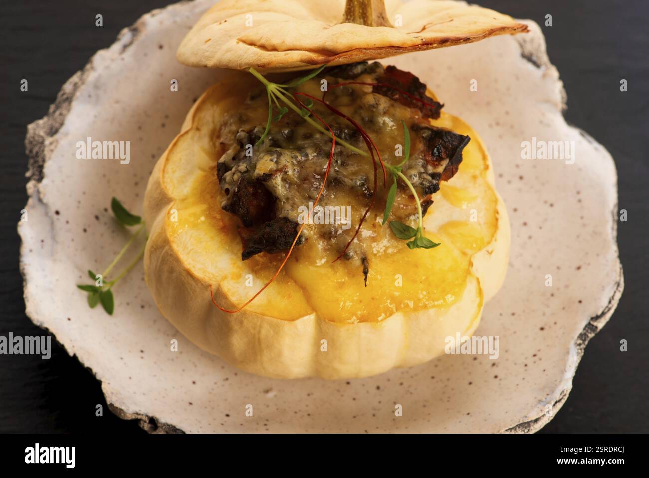 Delicious autumn recipe for stuffed pumpkin Stock Photo - Alamy