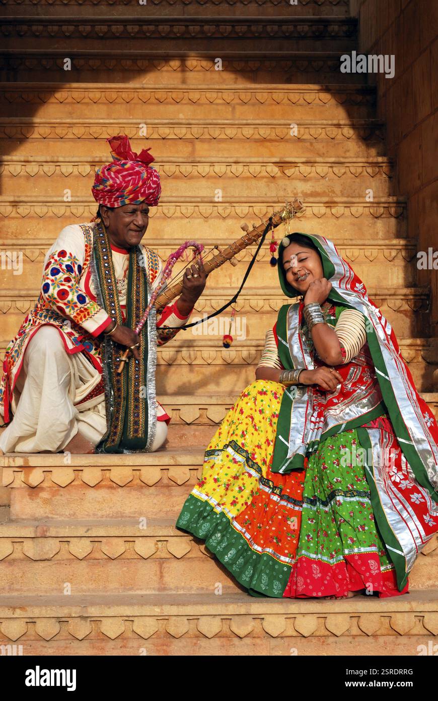Folk musician and lady with ravanhatta on steps of Baba Ramdeo temple ...