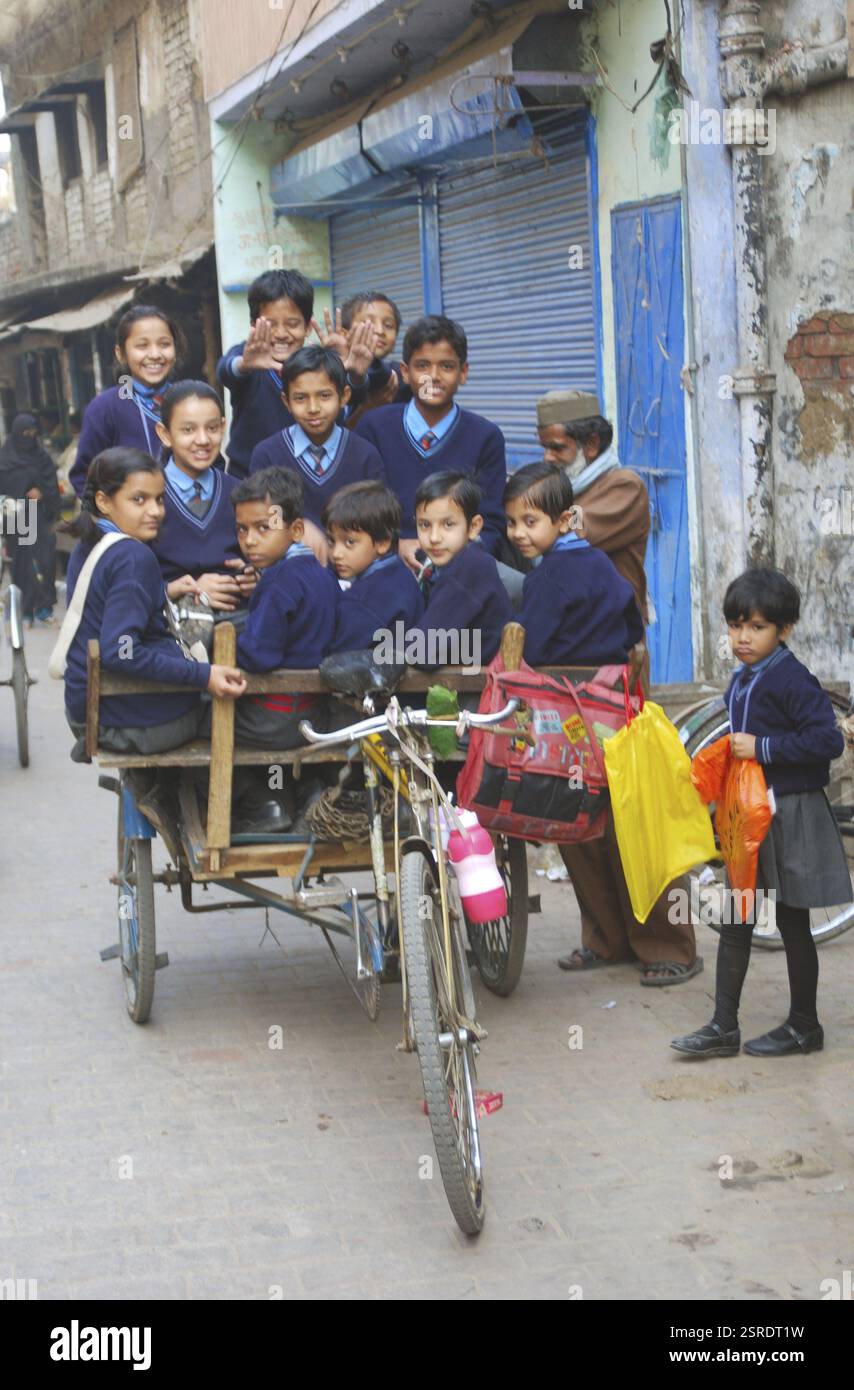 Kids in cycle rickshaw going to school, Lucknow, Uttar Pradesh, India ...